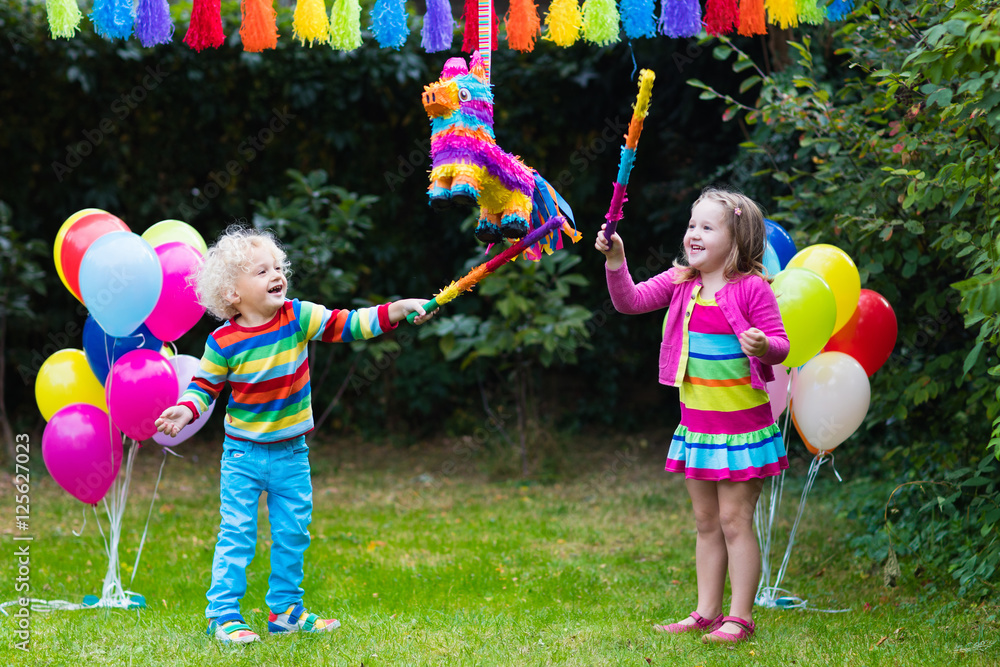 Kids playing with birthday pinata Stock-Foto | Adobe Stock
