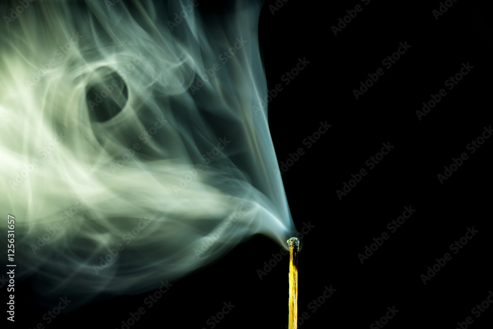 A half burned matchstick smoking in a circular wave Stock Photo | Adobe ...