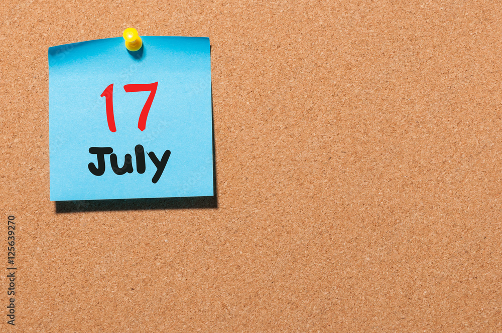 July 17th. Day 17 of month, color sticker calendar on notice board ...
