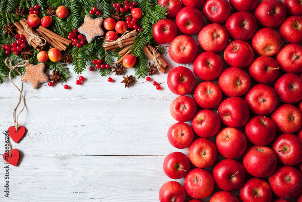 Christmas background with red apples, spices, cookie and heart Stock ...
