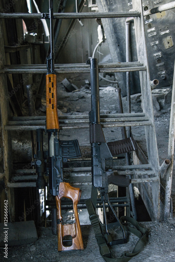 Sniper rifle SVD and machine "SHAFT" stand by the stairs. Stock Photo ...