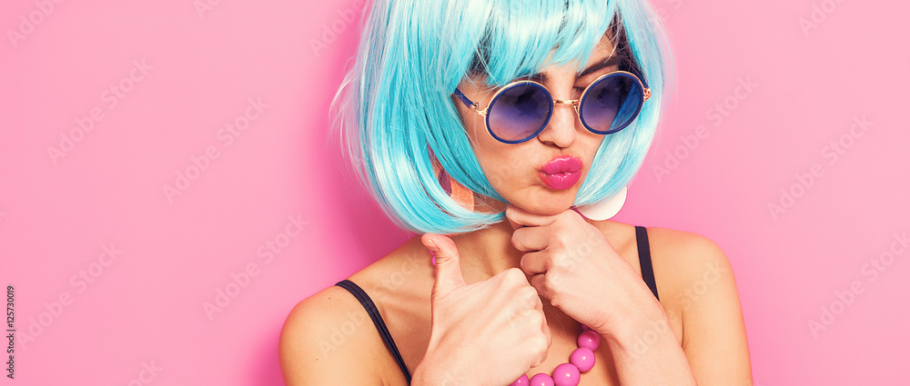 Pop girl portrait with thumbs up wearing weird accessories letterbox ...