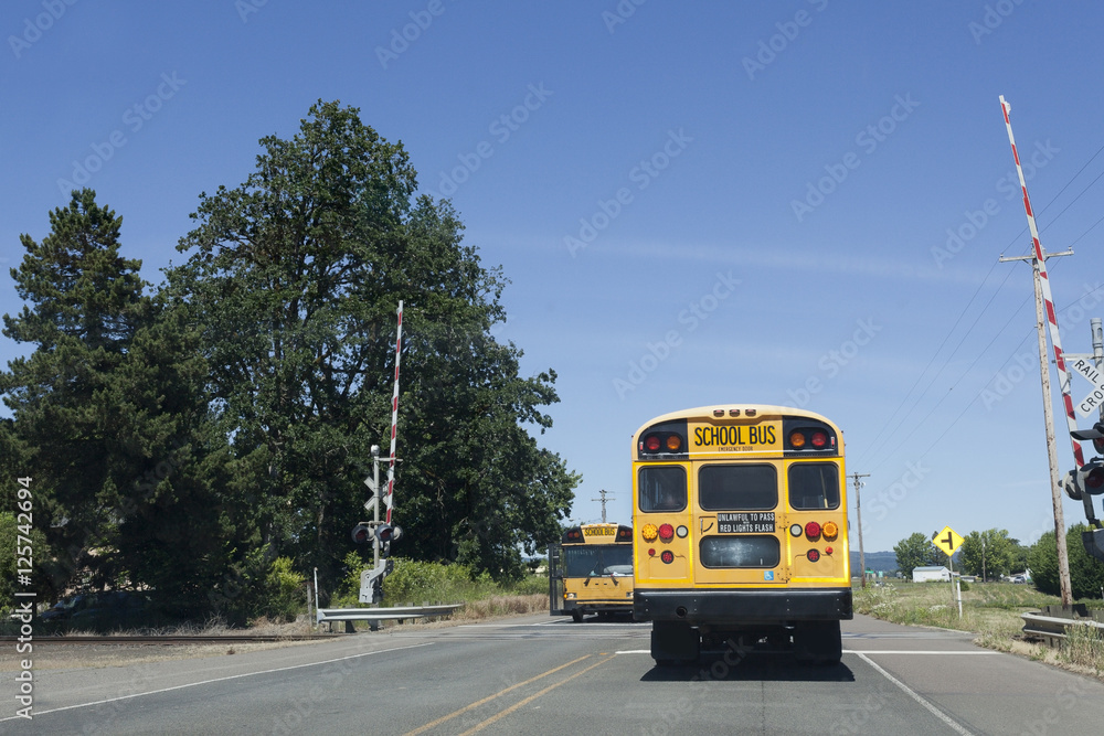 School Buses at Railroad Crossing Stock Photo | Adobe Stock