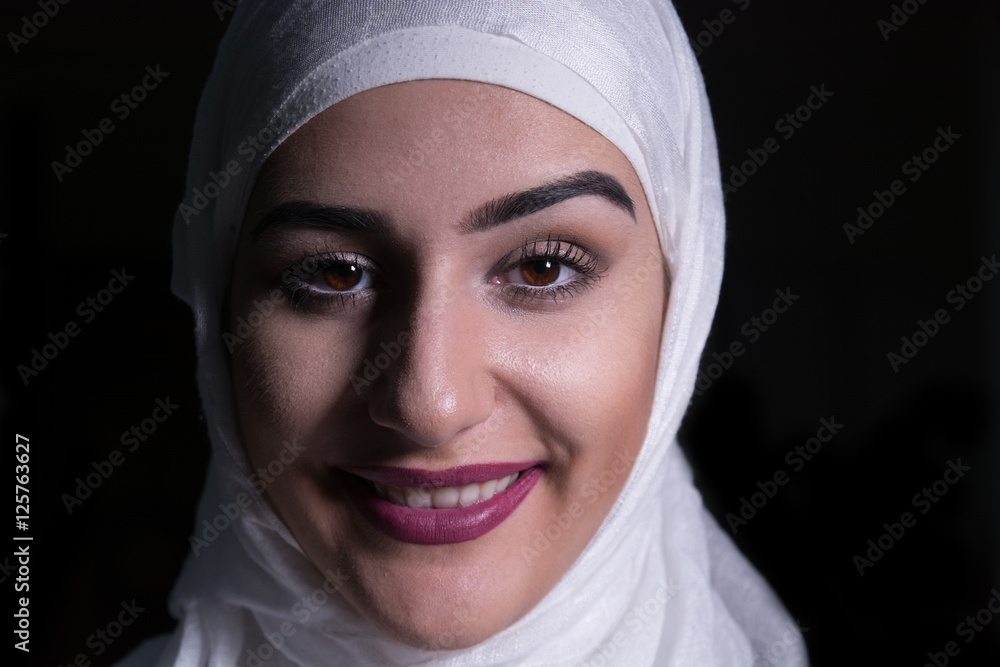 Beutiful Muslim Girl Portrait isolated in dark Stock Photo | Adobe Stock