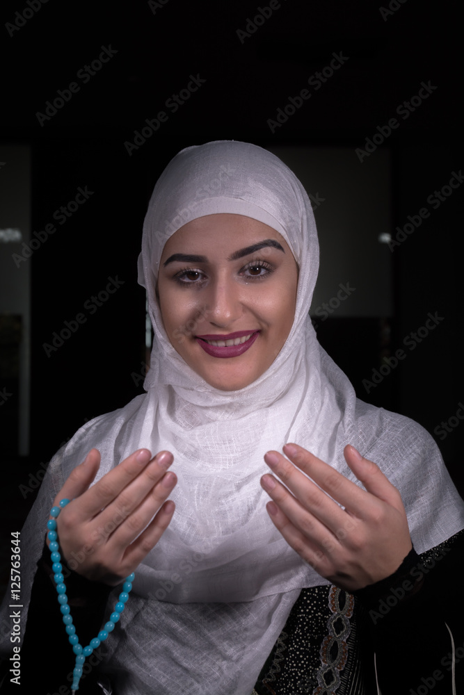 Beutiful Muslim Woman praying in mosque in dark Stock Photo | Adobe Stock