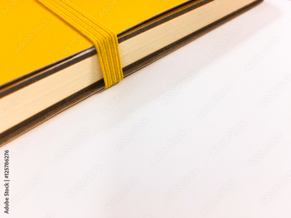 Yellow book on white background. Stock Photo | Adobe Stock