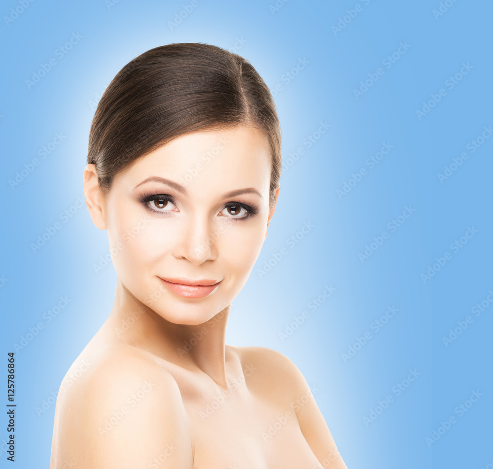 Portrait of a young woman on a light blue background Stock Photo ...