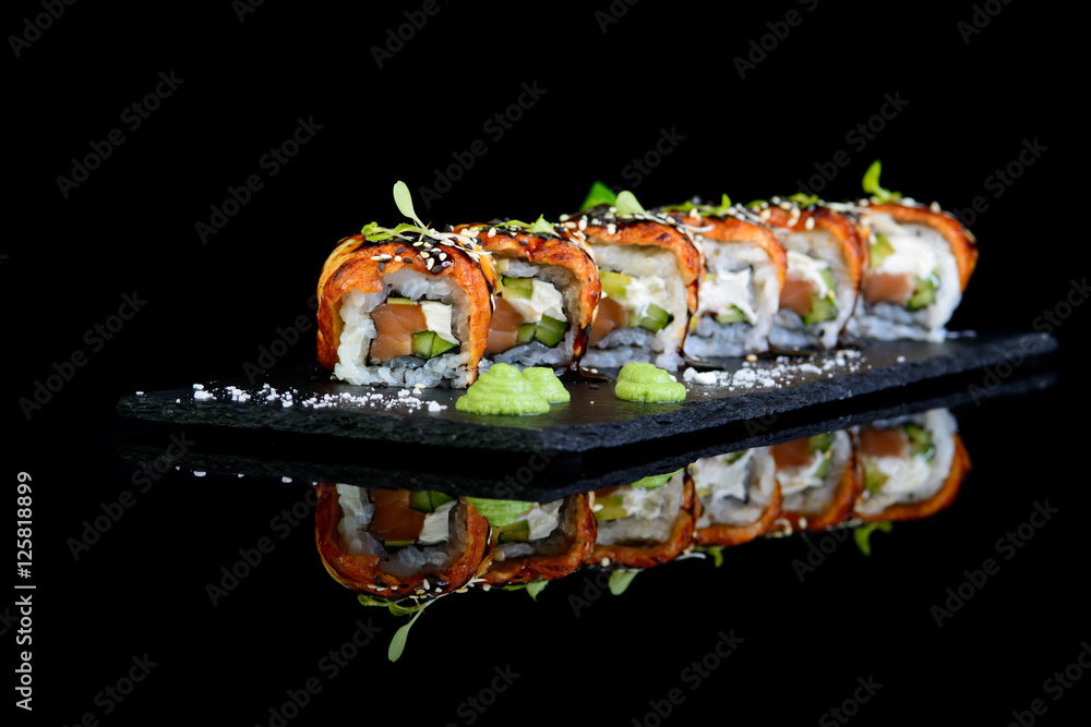 Canadian roll on a black background with reflection Stock Photo | Adobe ...