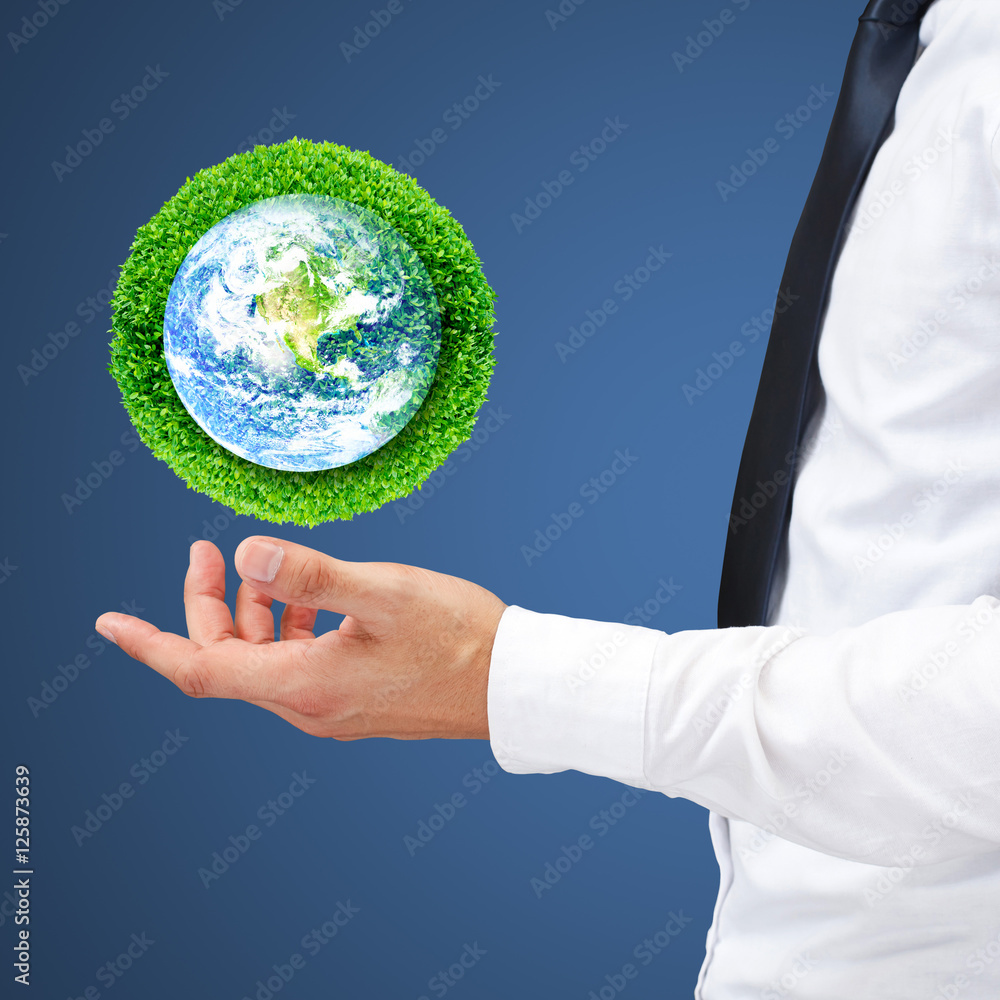 Save the earth by trees. Human hand holding global in soil with green ...