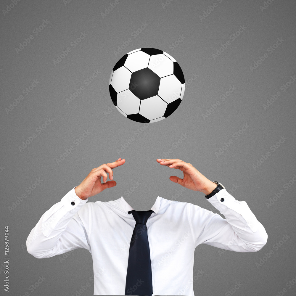 Young man with a soccer ball instead of the head. Stock Photo | Adobe Stock
