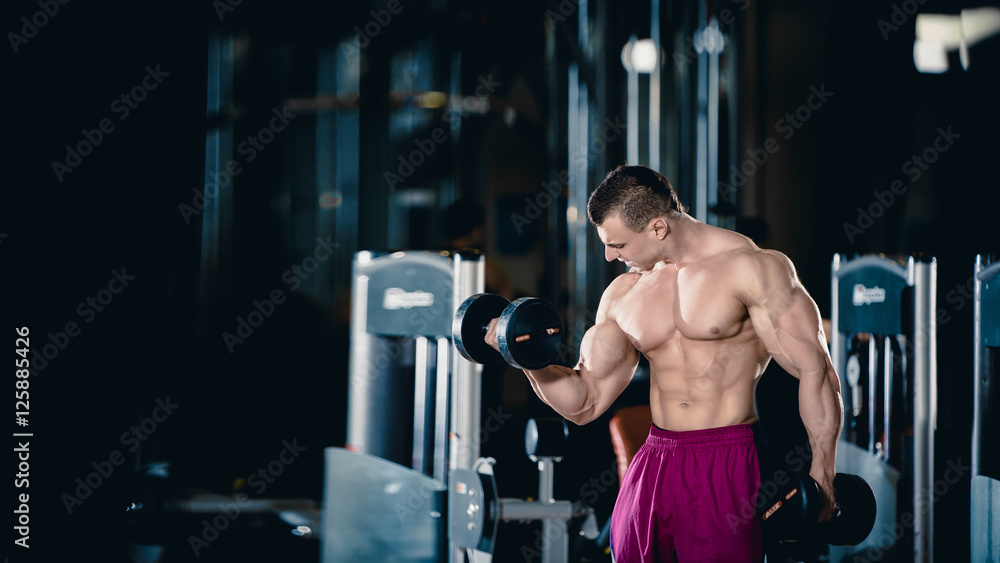 Male bodybuilder, fitness model trains in the gym Stock Photo | Adobe Stock