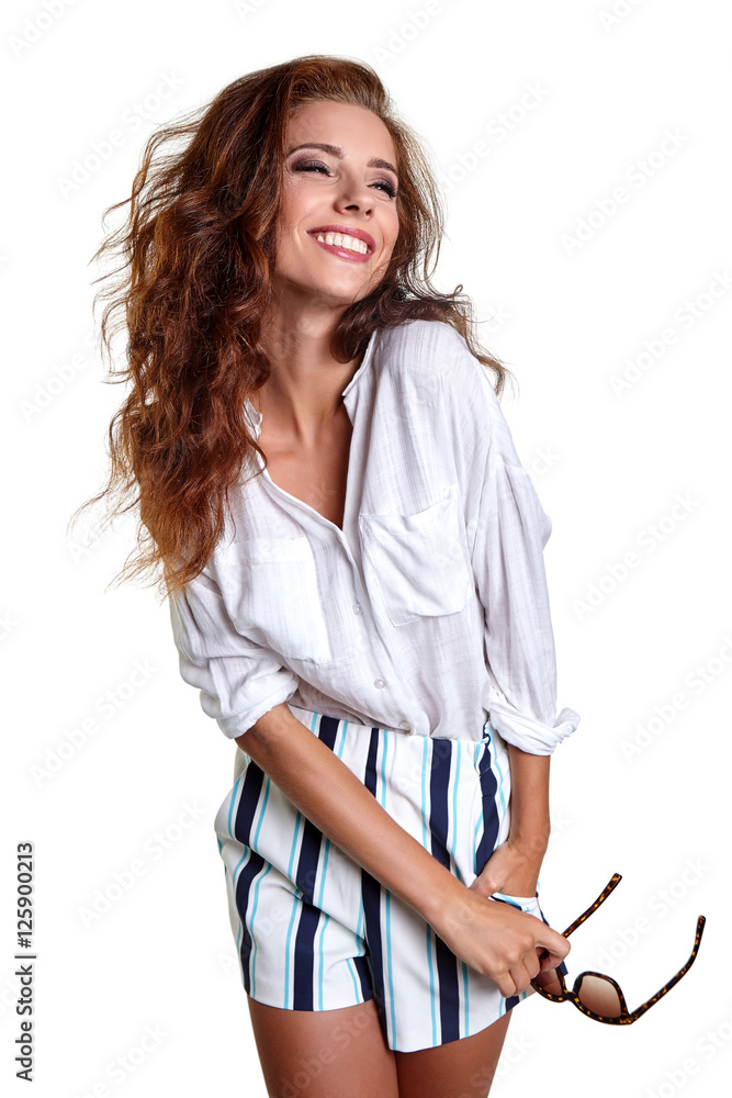 smiling young slim tanned female in denim shorts shrugging her s Stock ...