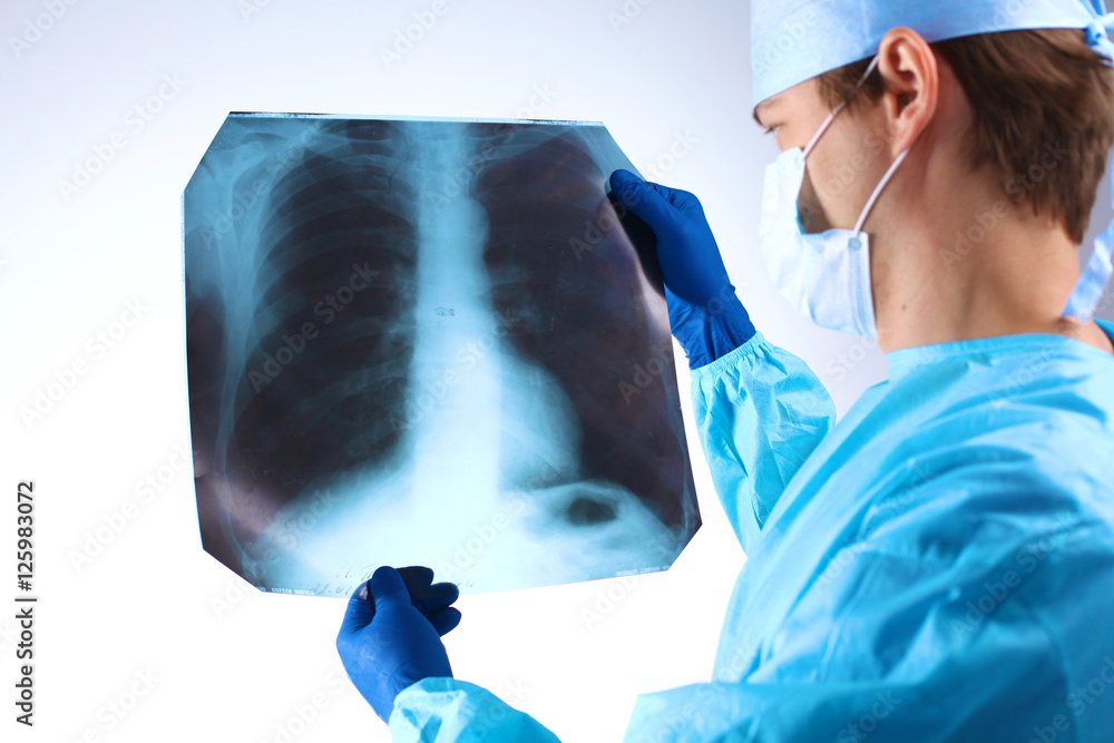 Doctor examining a lung radiography x-ray Stock Photo | Adobe Stock