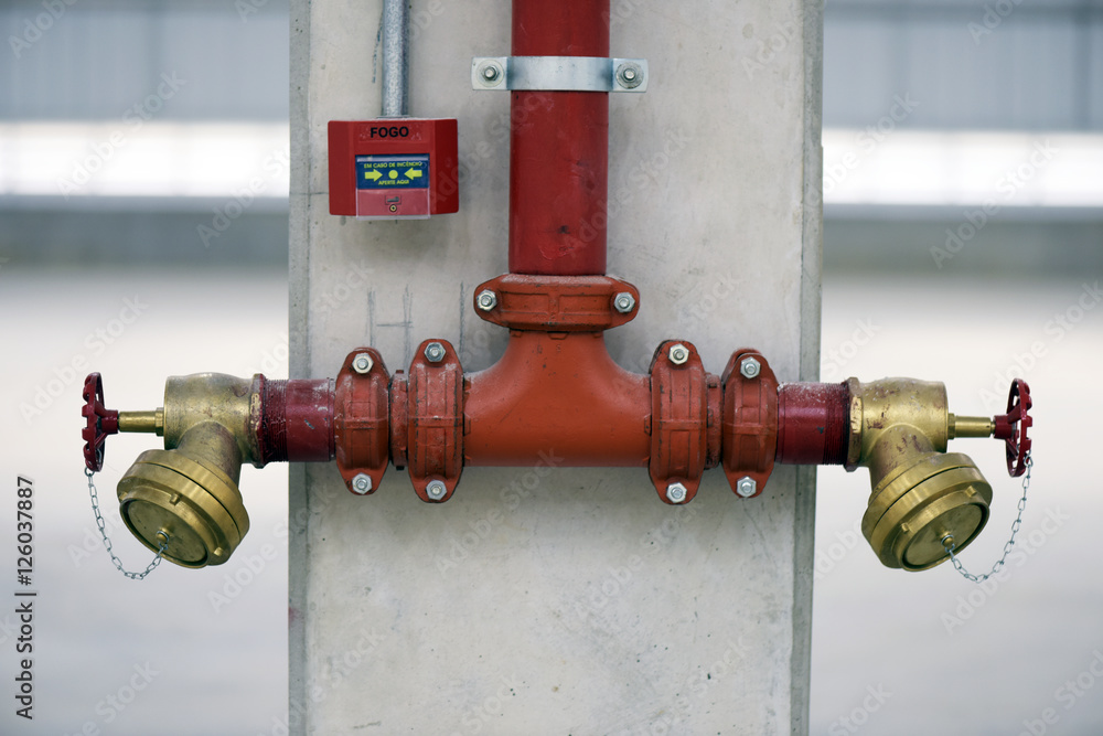 Industrial fire hydrant installed on concrete column Stock Photo ...