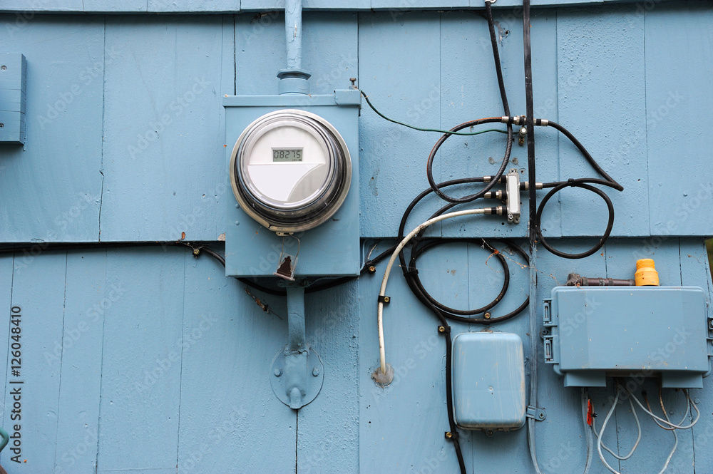 old electric meter installed on the wall of house exterior Stock Photo ...