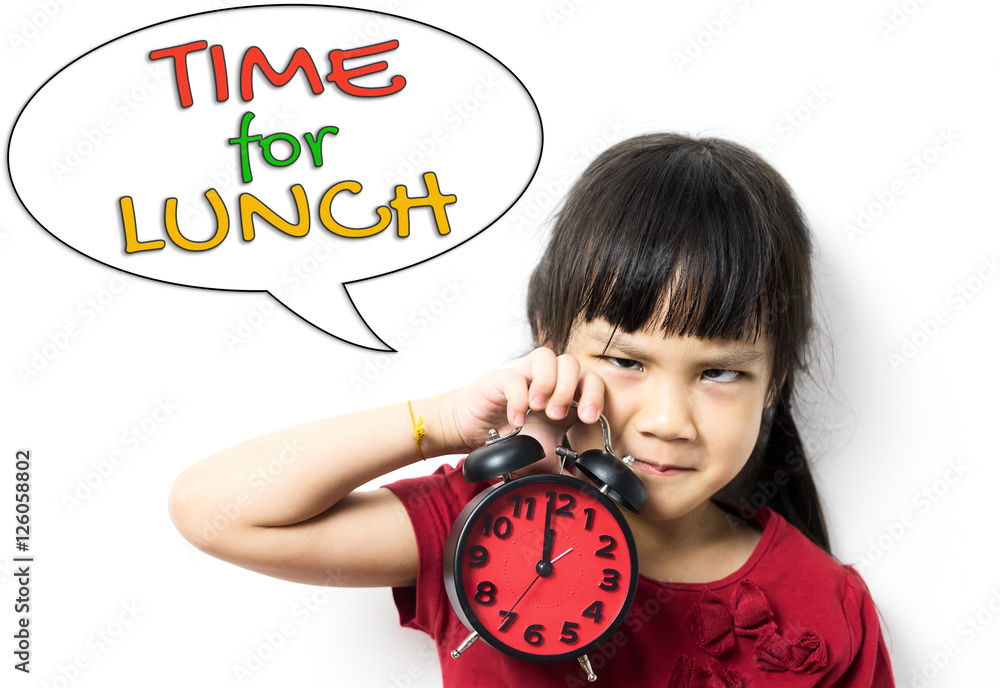 Asian little kid is holding the clock reminding you she need to go for ...