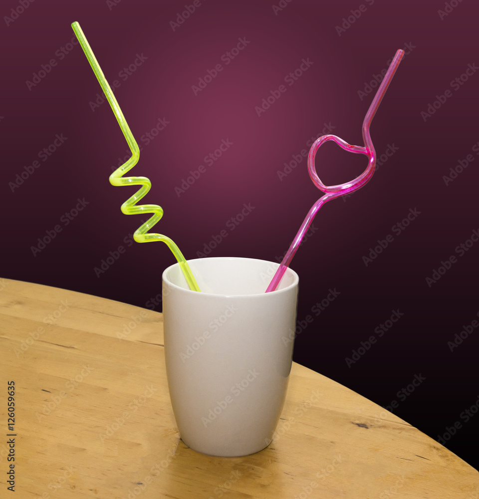 Two curly straws in a shared drink on wood table isolated Stock Photo ...