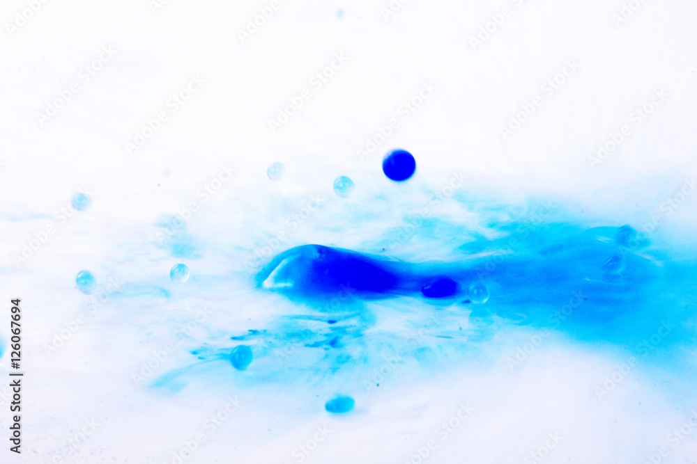 Paint drop splashing on black a background Stock Photo | Adobe Stock