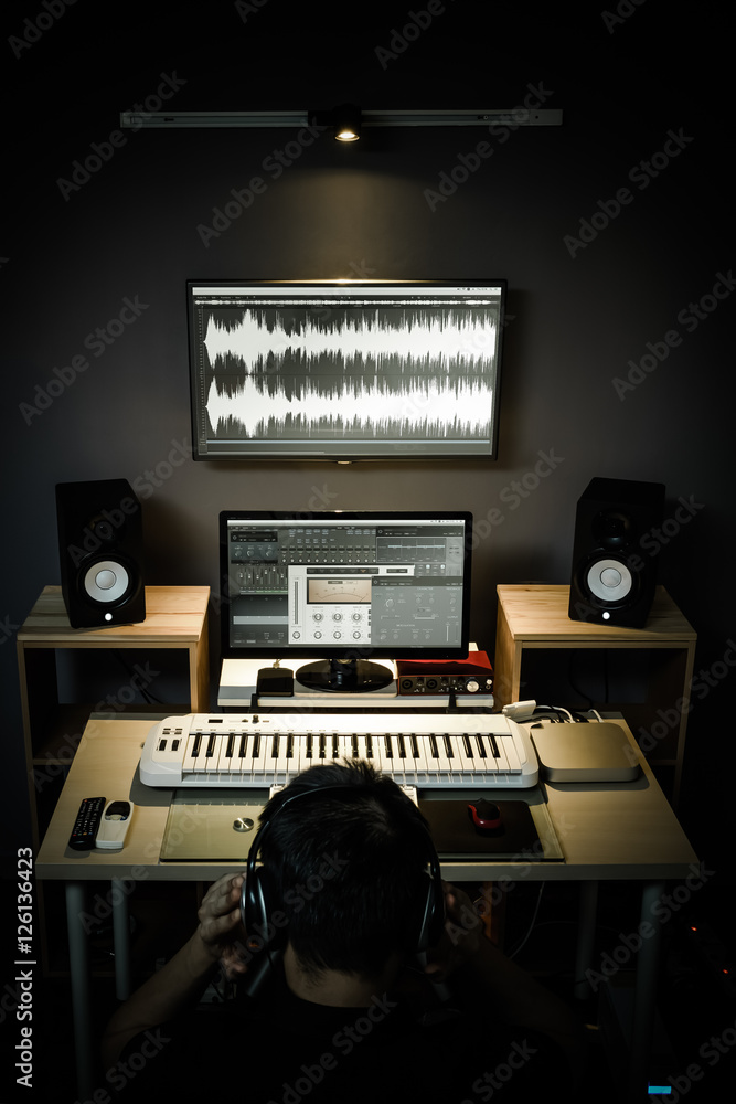 sound engineer, producer working in digital editing studio for tv ...