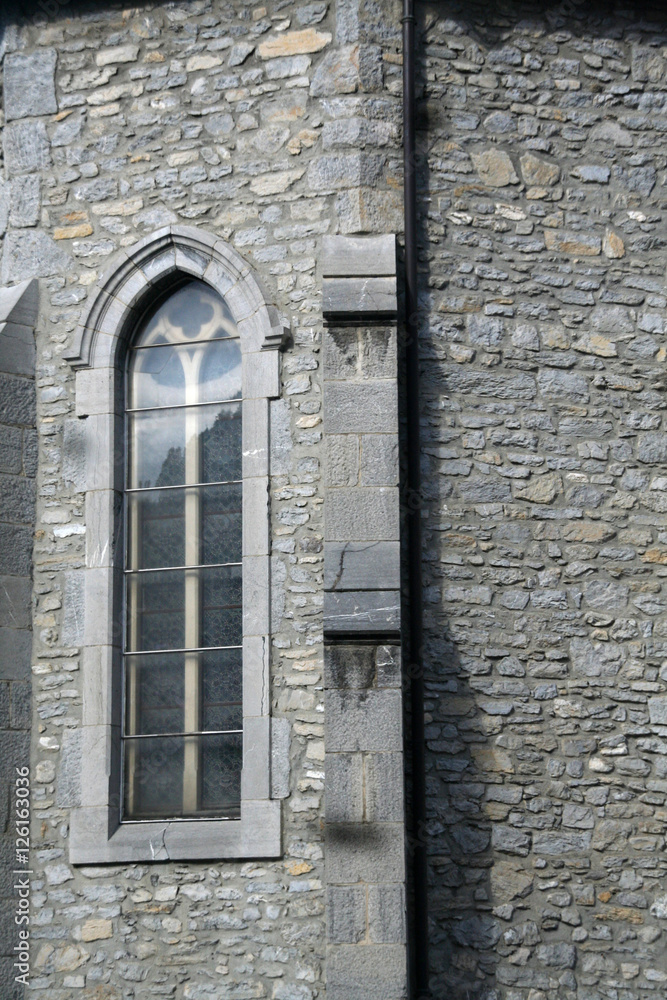Window, buttress & stone wall Stock Photo | Adobe Stock