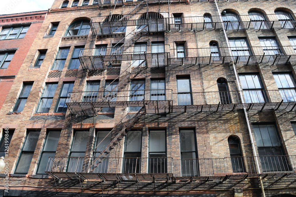 old building with iron fire escape stairs Stock Photo | Adobe Stock