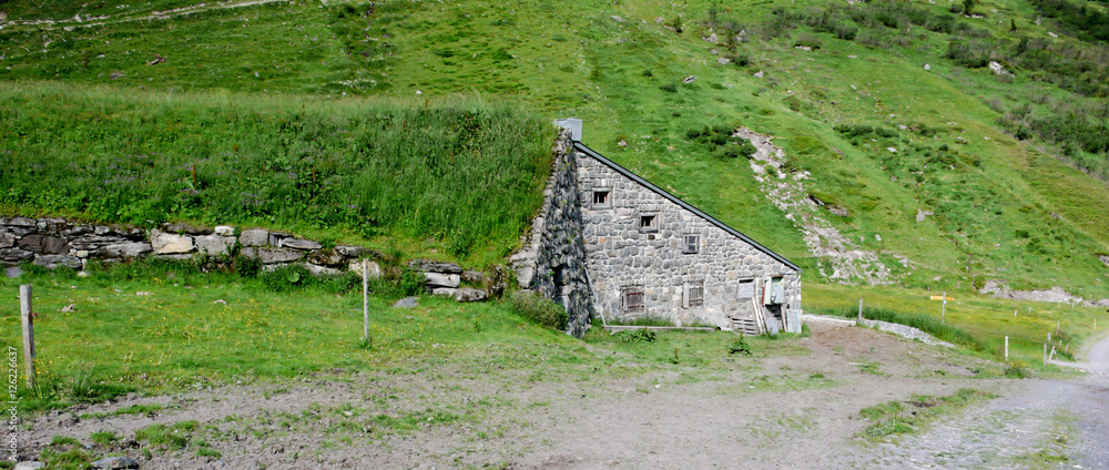 mountain barn on an alp in the Swiss Alps in the Weisstannen Valley ...