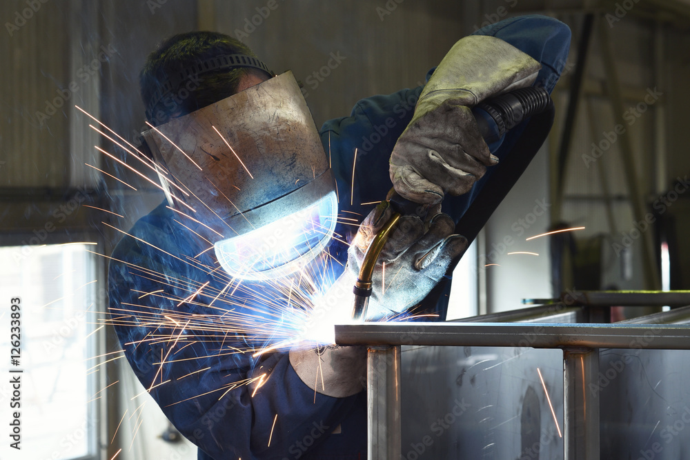 Schweißer in der Industrie // welder at work Stock Photo | Adobe Stock