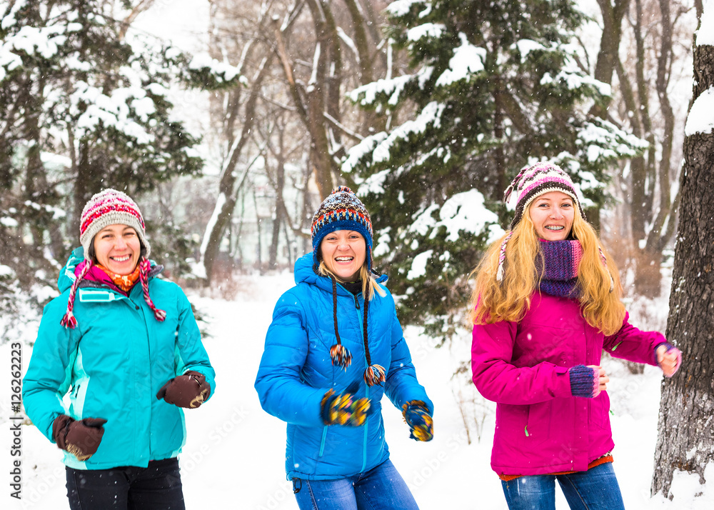 Happy friends having fun in winter cild snowing weather at park Stock ...