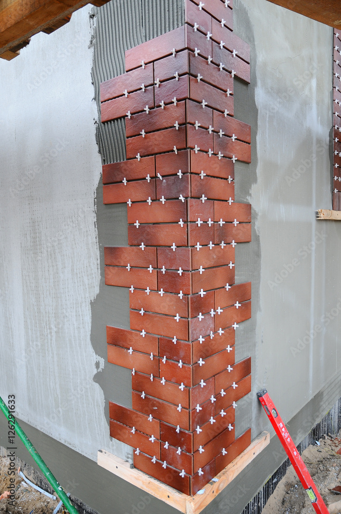 The building under construction. Walls under construction are insulated ...