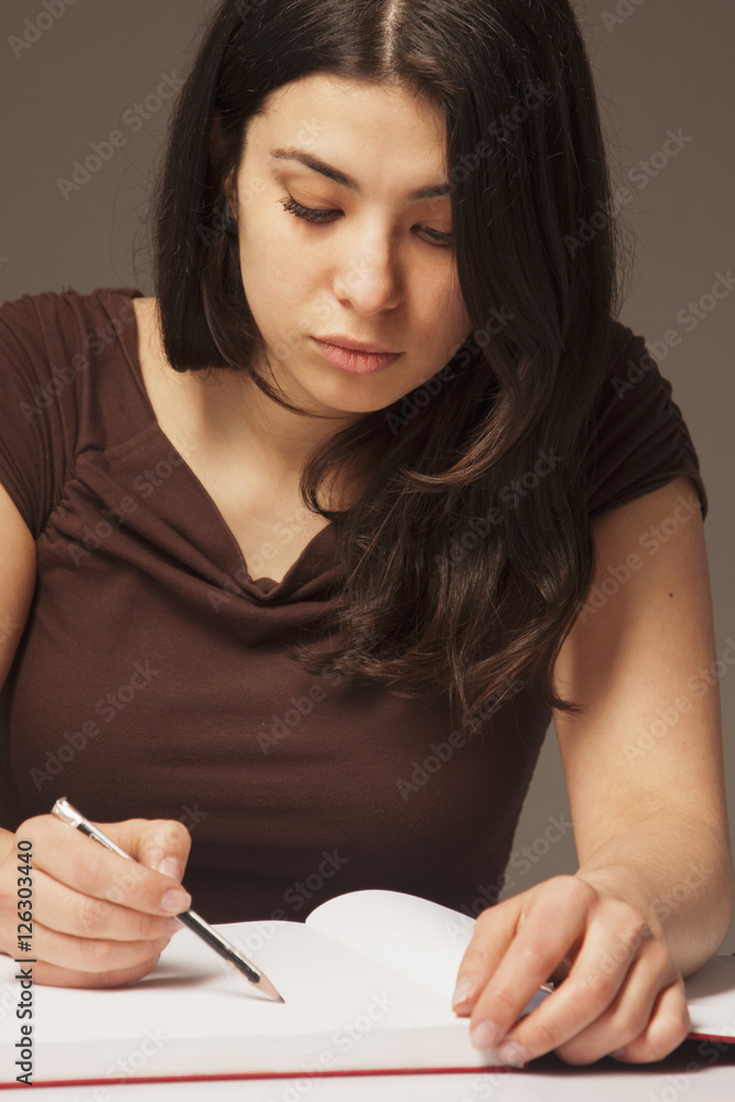 young beautiful girl is preparing for exam Stock-Foto | Adobe Stock