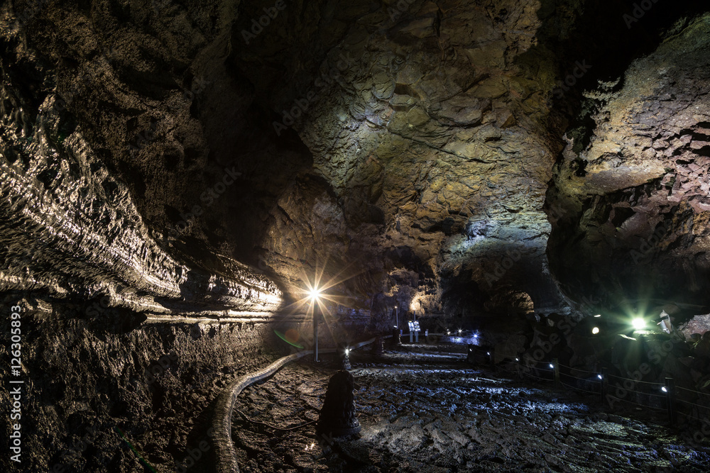Inside the dark, lit and empty Manjanggul Lava Tube Cave on Jeju Island ...