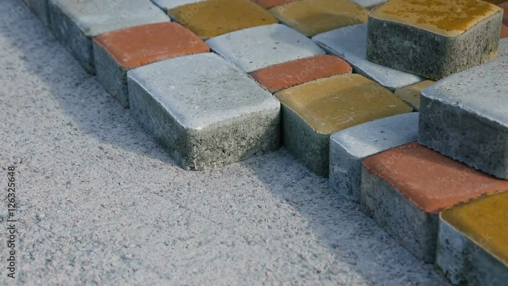 Laying Paving Slabs by mosaic close-up. Road Paving, construction ...