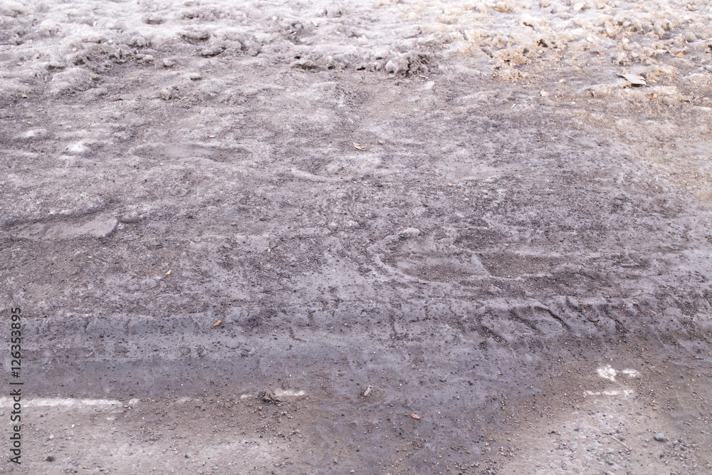 Very dirty ice on the roadside. Environmental pollution along the roads ...