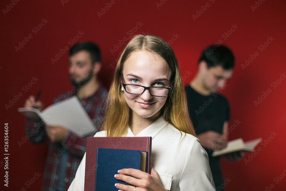 attractive happy smiling student blonde girl in white shirt with books ...