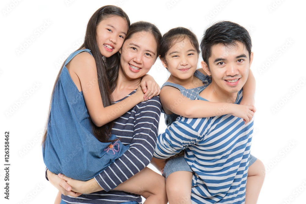 Happy Asian family smiling and lying on isolated white background ...