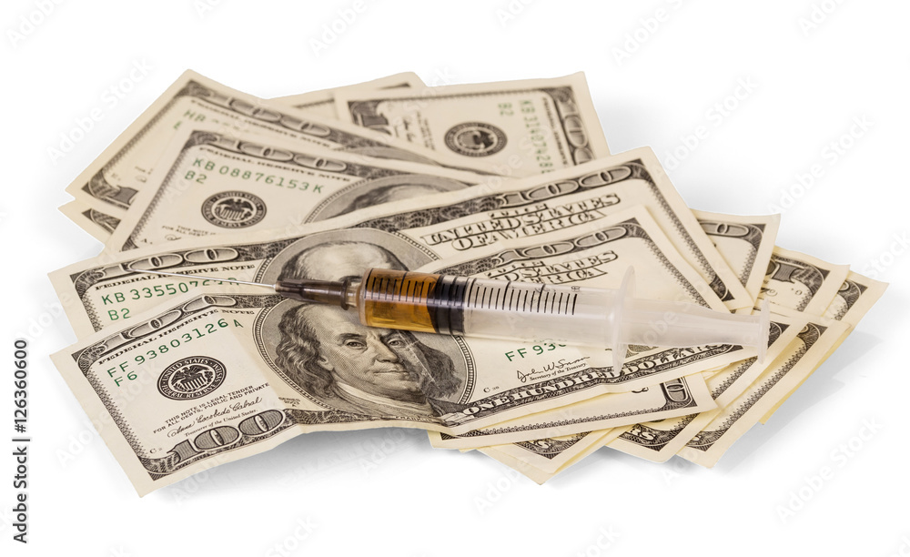 Syringe for injection with medication and dollars isolated on white ...