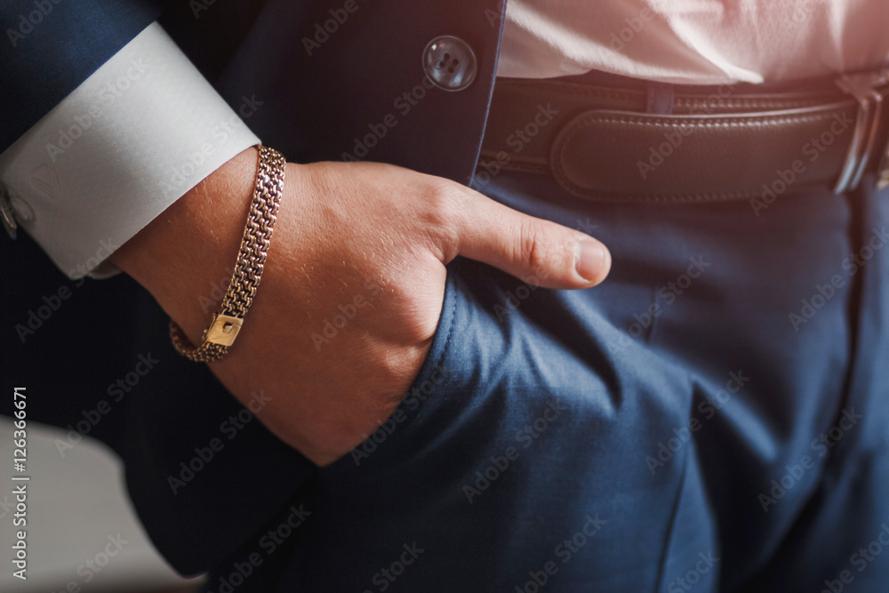 body detail of a business man. Closeup hand with jewelry chain in ...