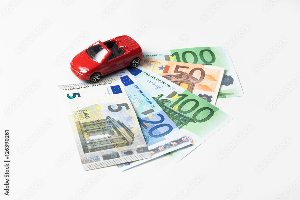 Modellauto und Euroscheine auf weißem Hintergrund Stock Photo | Adobe Stock