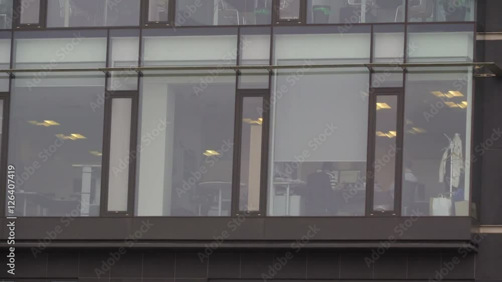 Closer look of the office inside the glass window in one of the ...