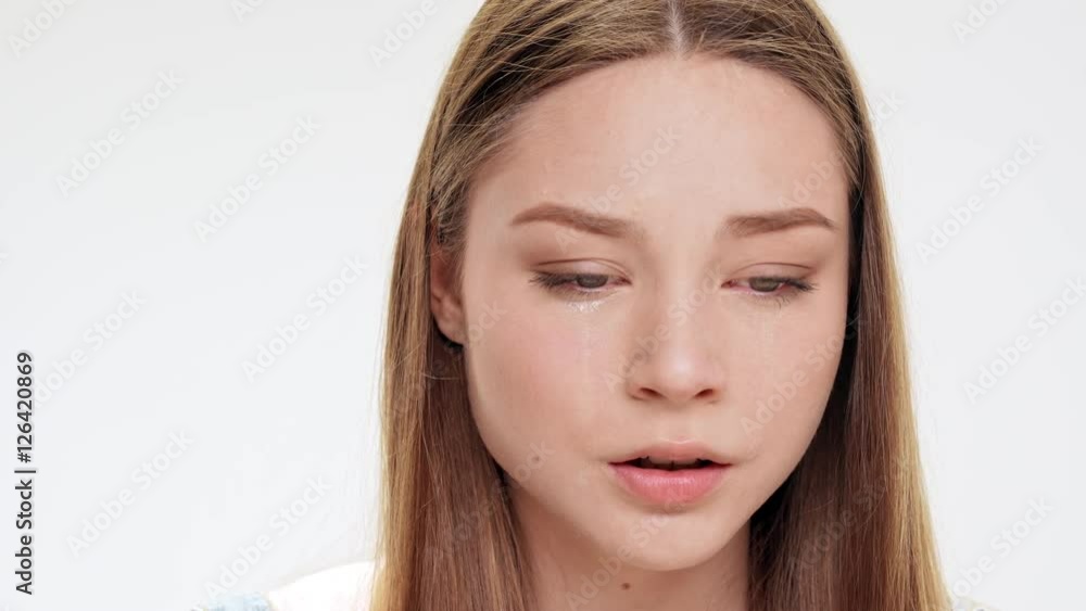 Sad young beautiful girl over crying white background. Stock Video ...