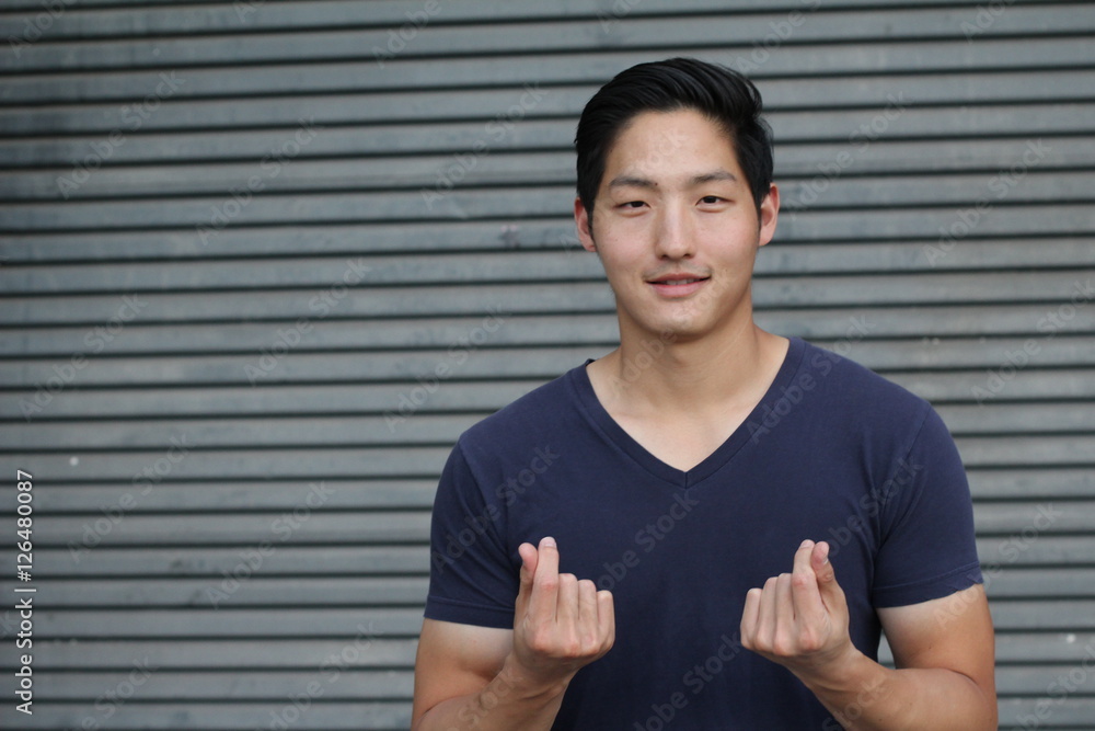 Smiley Asian man making finger heart sign. Korean heart finger sign ...