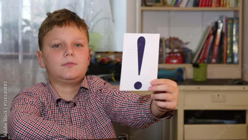 Young funny boy holding piece of papers with exclamation point Stock ...