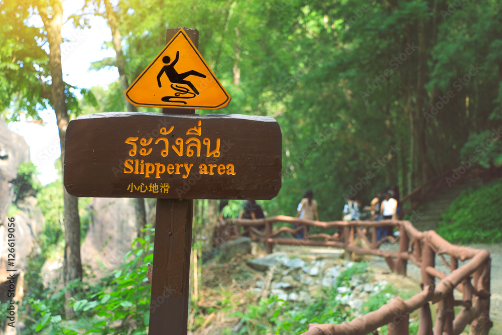 Sign showing a slippery area in Obluang National Park, Thailand Stock ...