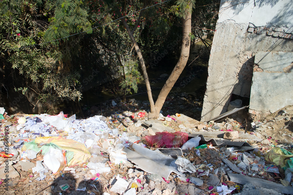 Terrible unsanitary conditions of Indian slum. The side of the road 1 ...