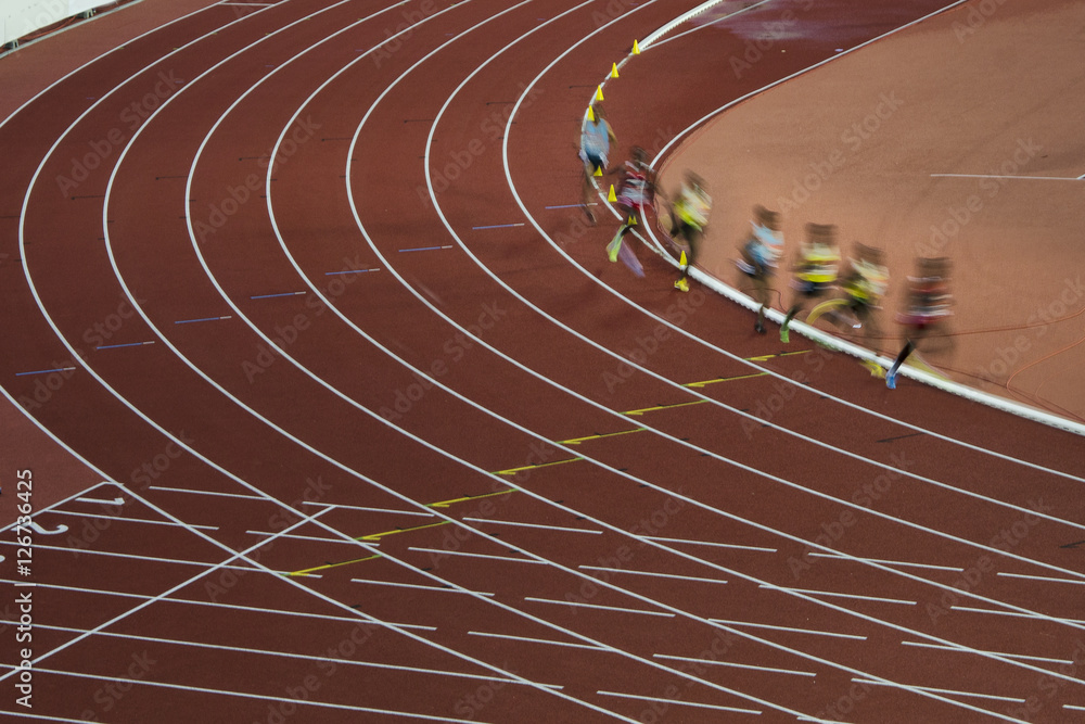 Group of professional athletes on the long distance track during ...