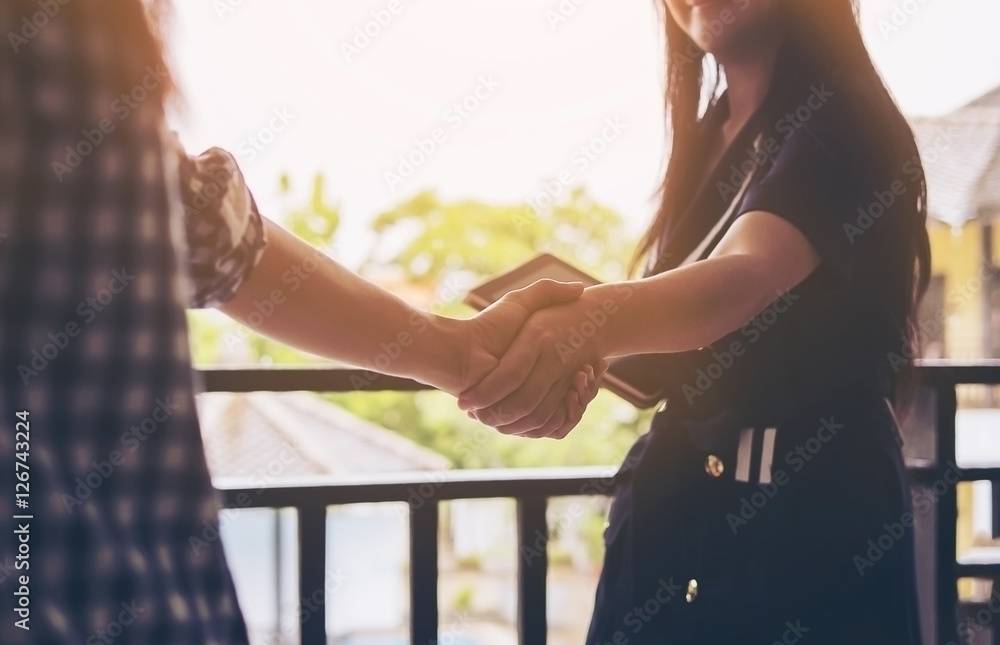Two women give handshake after agreement in the office Stock Photo ...
