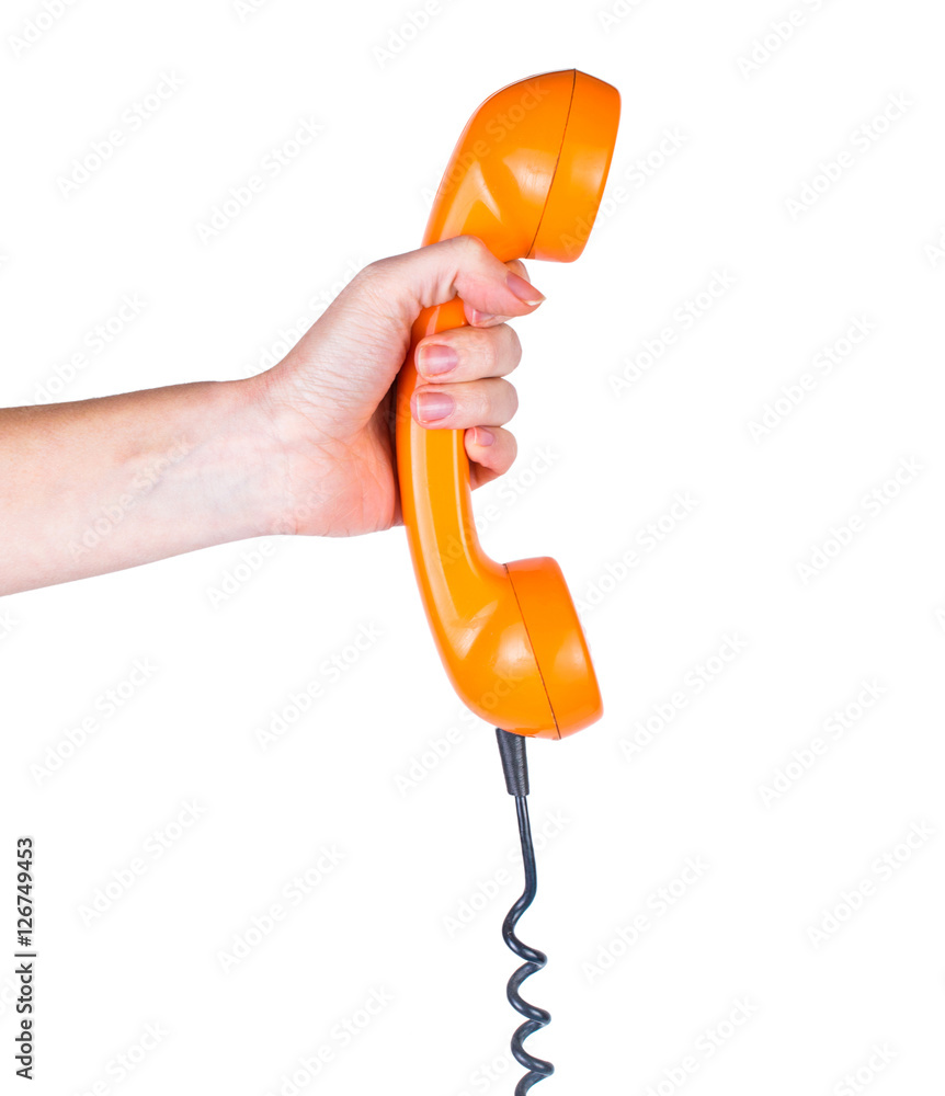 Orange handset in hand on a white background Stock-Foto | Adobe Stock