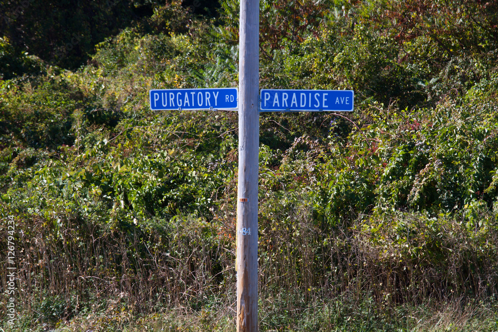 Street signs at the corner of paradise and purgatory Stock Photo ...