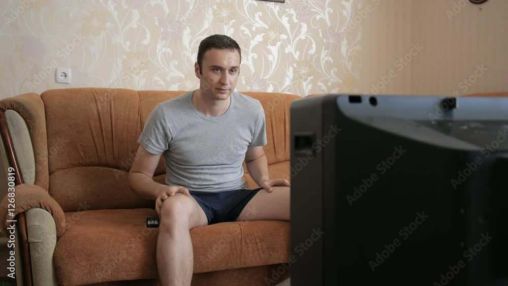 The man frustrated that his old television is not working. The man ...