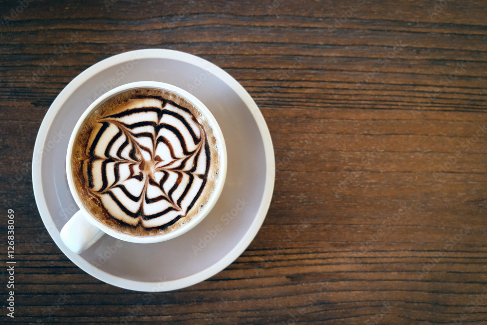 Mocha coffee (also called Caffe Mocha) with wooden saucer. Interior ...